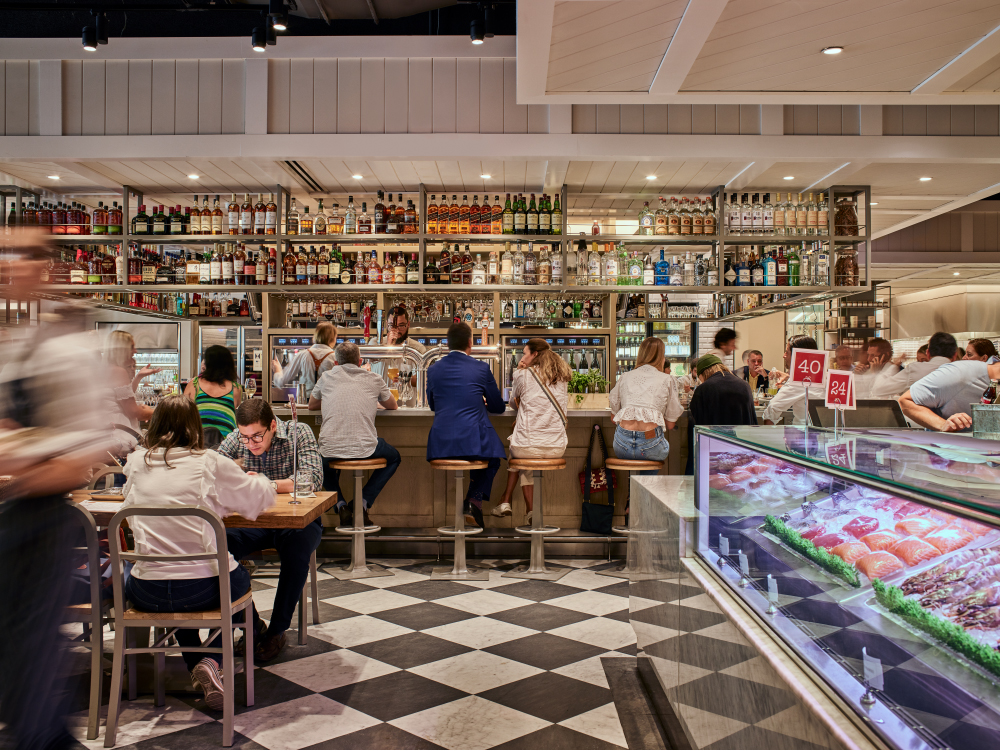 inside area with people at bar eating and drinking